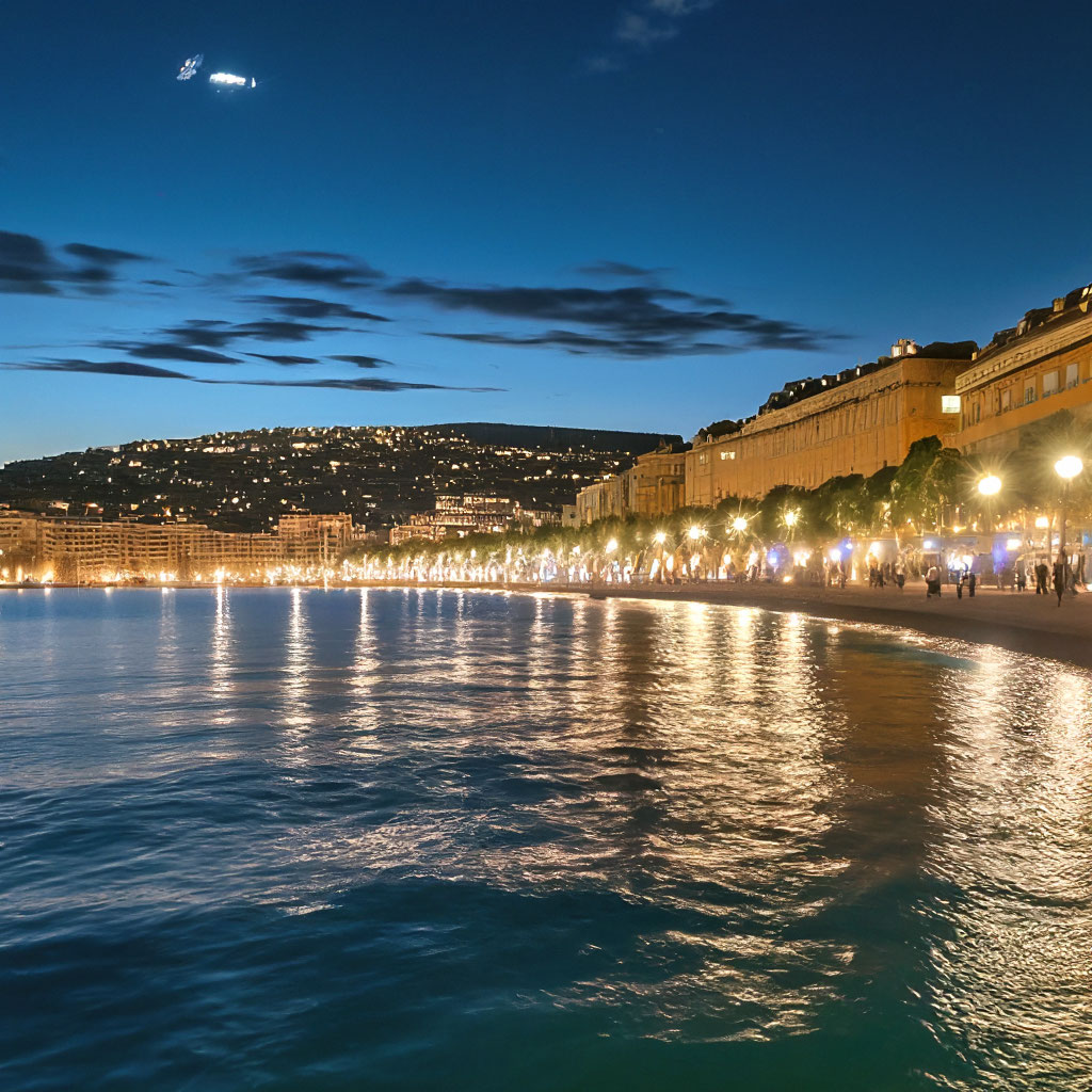 "Nice at night. The promenade. The city shimmers with lights. Top view ...